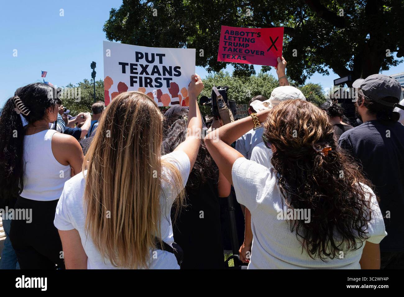 July 24, 2025: Supporters hold signs at the South steps of the Texas ...