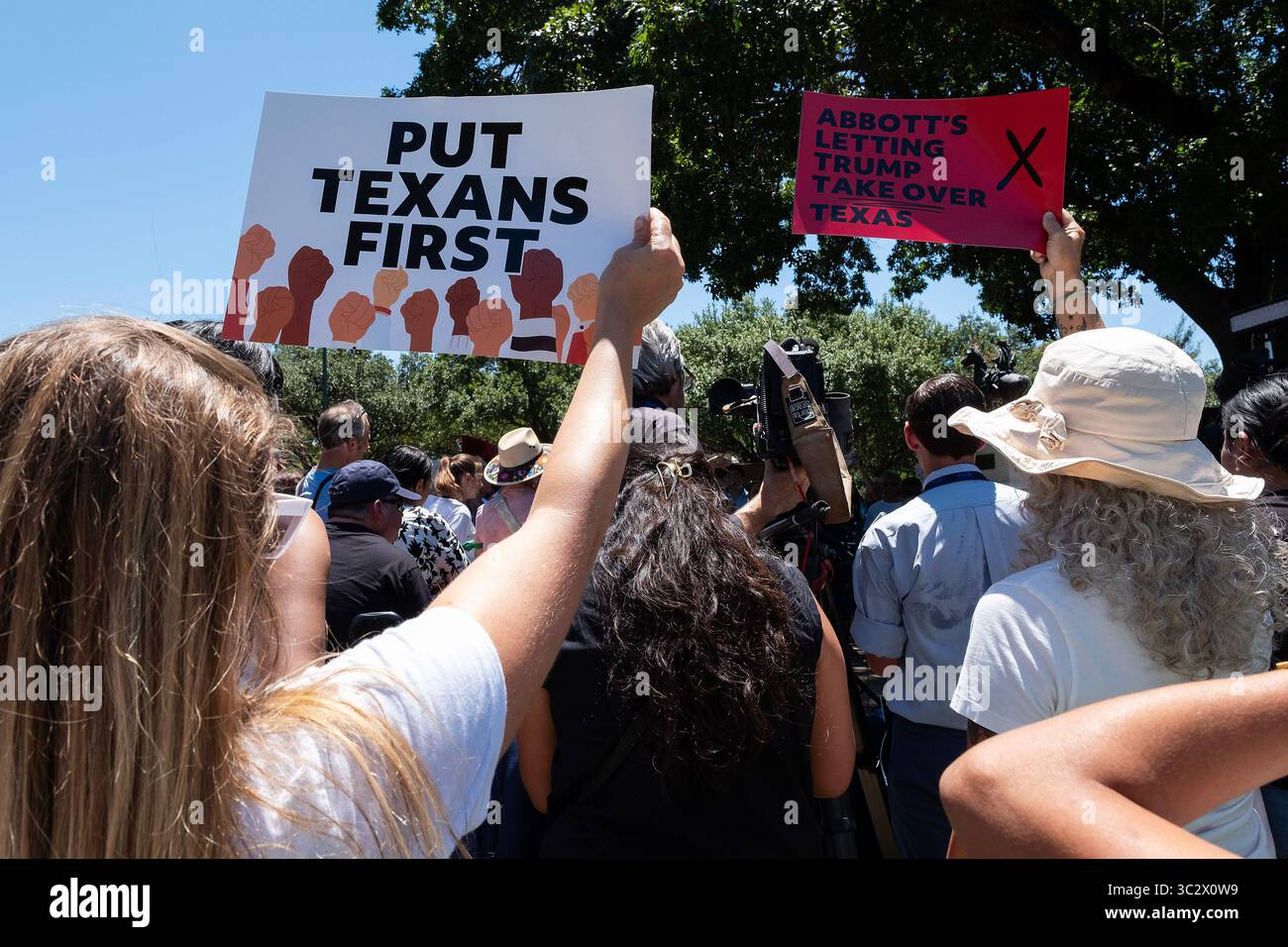July 24, 2025: Supporters hold signs at the South steps of the Texas ...