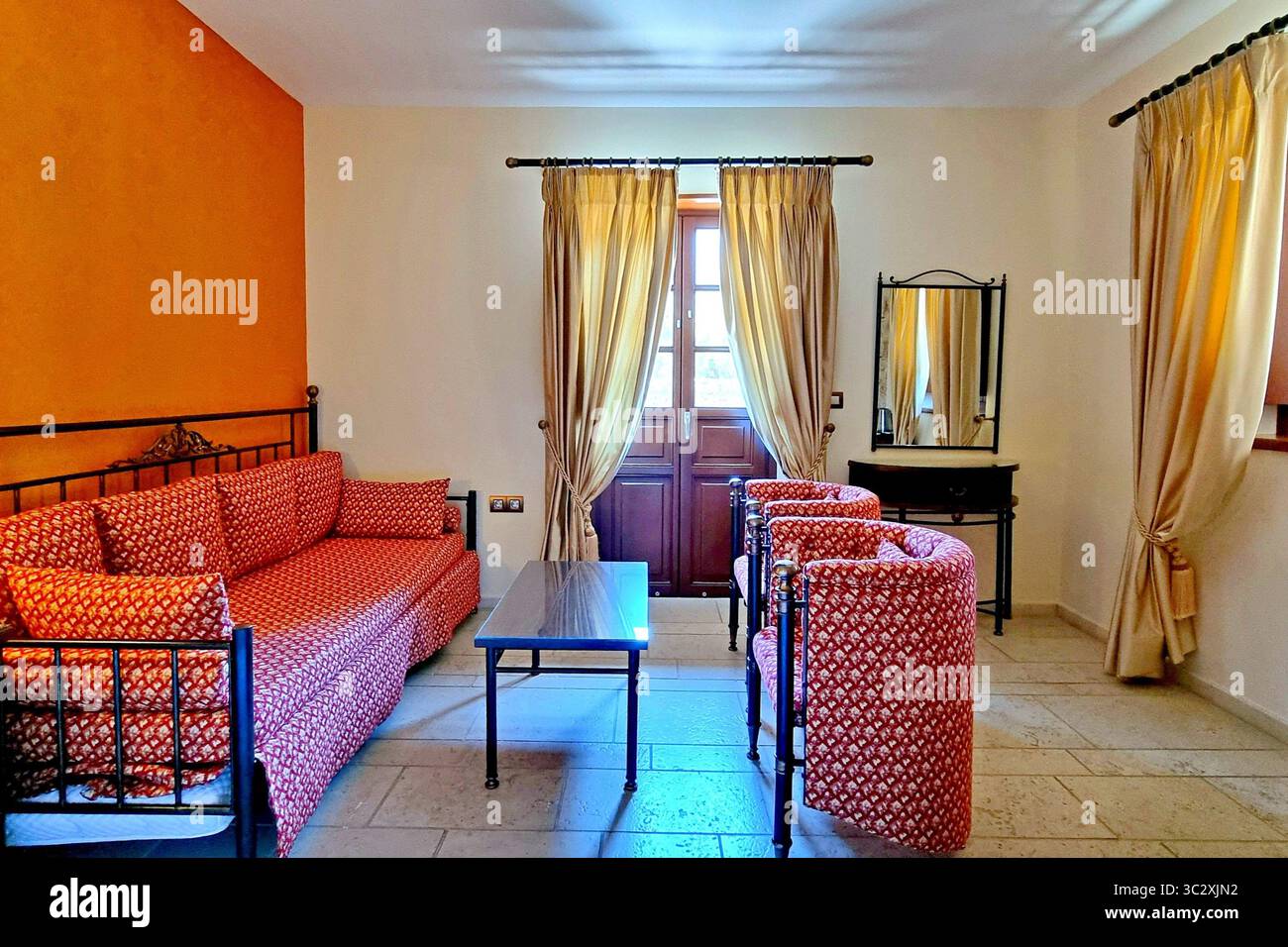 Interior of a cozy corner with a sofa and armchairs in the room of the ...