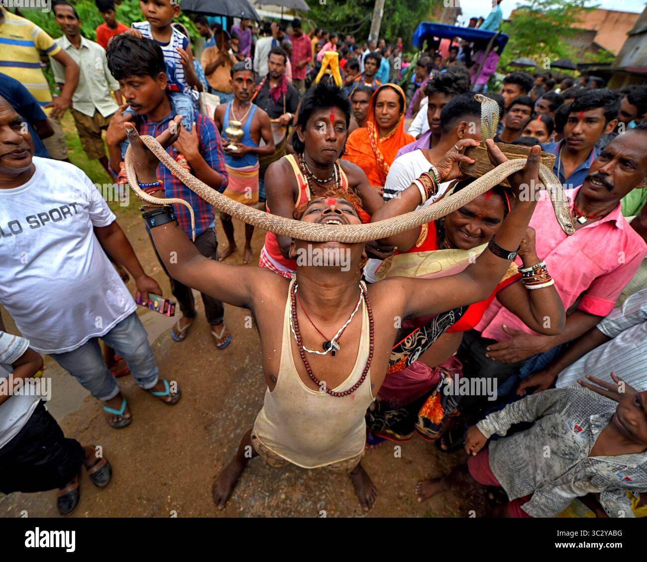 August 18, 2019, Silli, Jharkhand, India: A Snake Charmer and local villagers seen showing ...