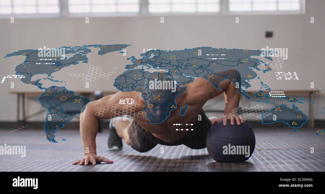 Man wearing shorts doing single-arm push-up using medicine ball on mat ...