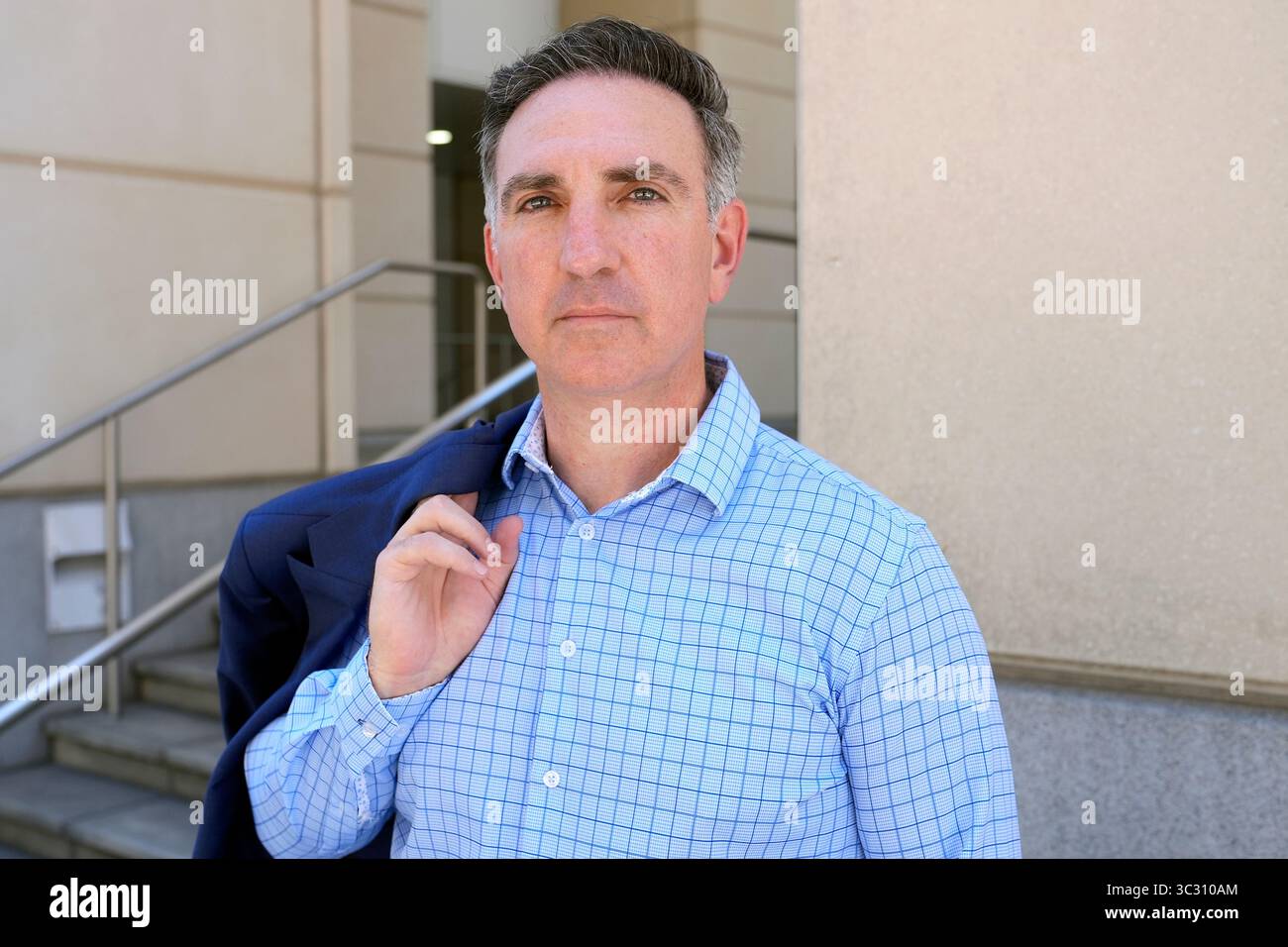 Former federal prosecutor Michael Gordon poses for a photo outside the ...