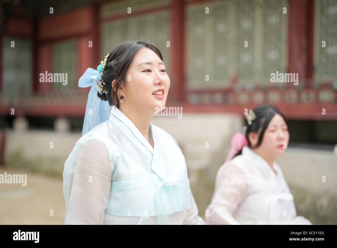 Seoul, June 2025: Two Korean women in their twenties stroll through ...