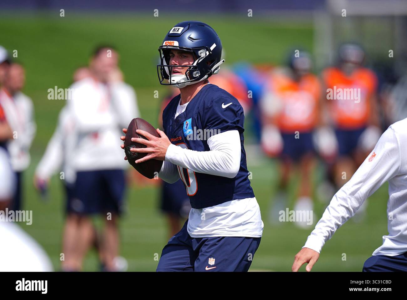 Denver Broncos quarterback Bo Nix (10) takes part in drills during an NFL football practice ...