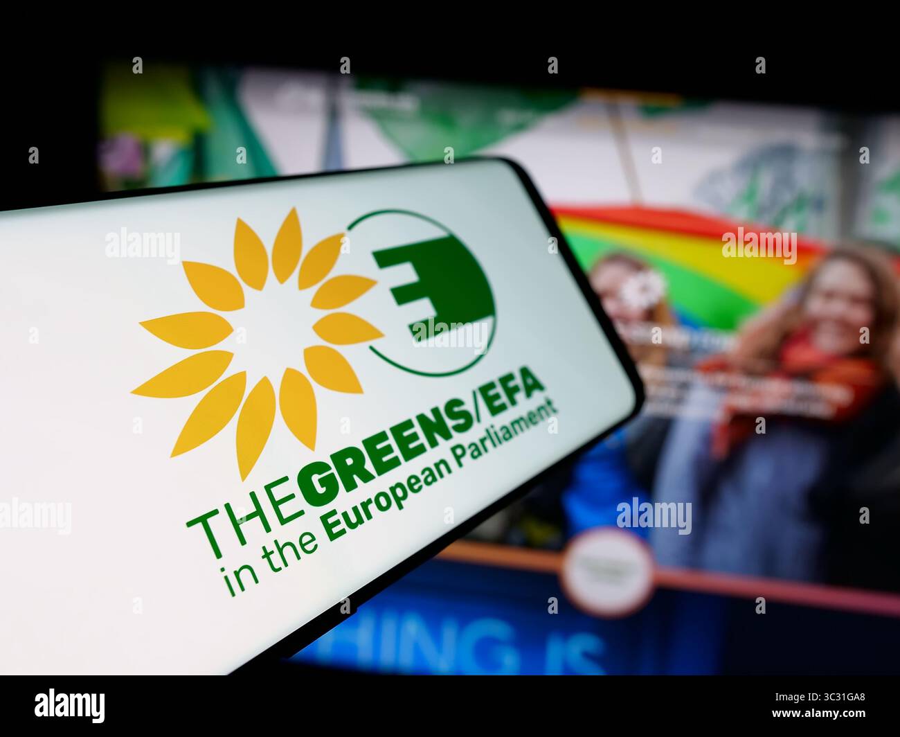 In this photo illustration, a smartphone with the logo of group Greens ...
