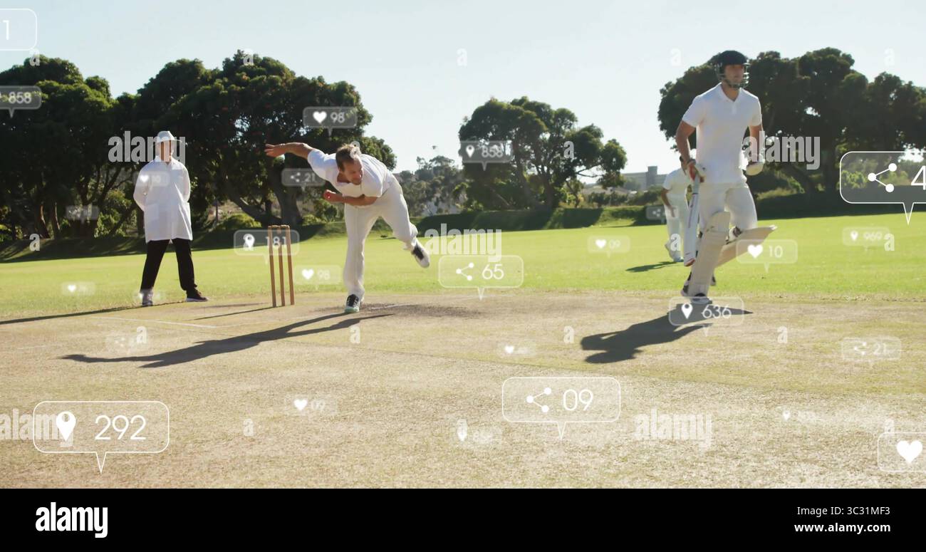 Delivering bowler in white uniform throwing ball on pitch, with stumps ...