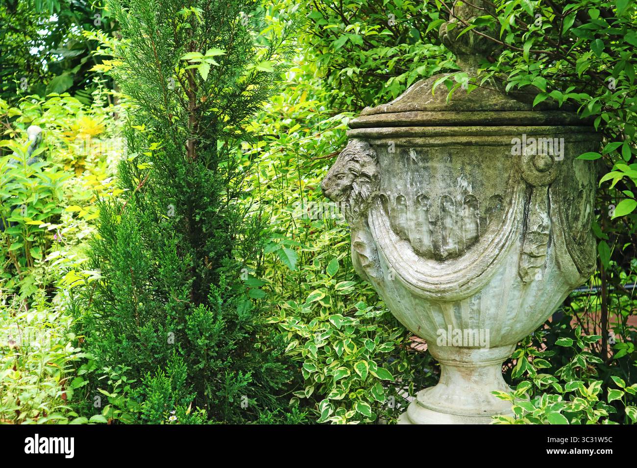 Gorgeous Old Stone Roman Vase Sculpture in a Garden Stock Photo - Alamy