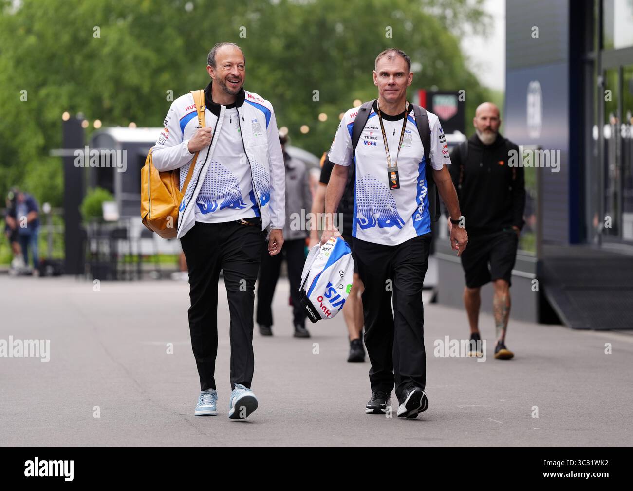 Racing Bulls' team principal Alan Permane (right) before practice at ...