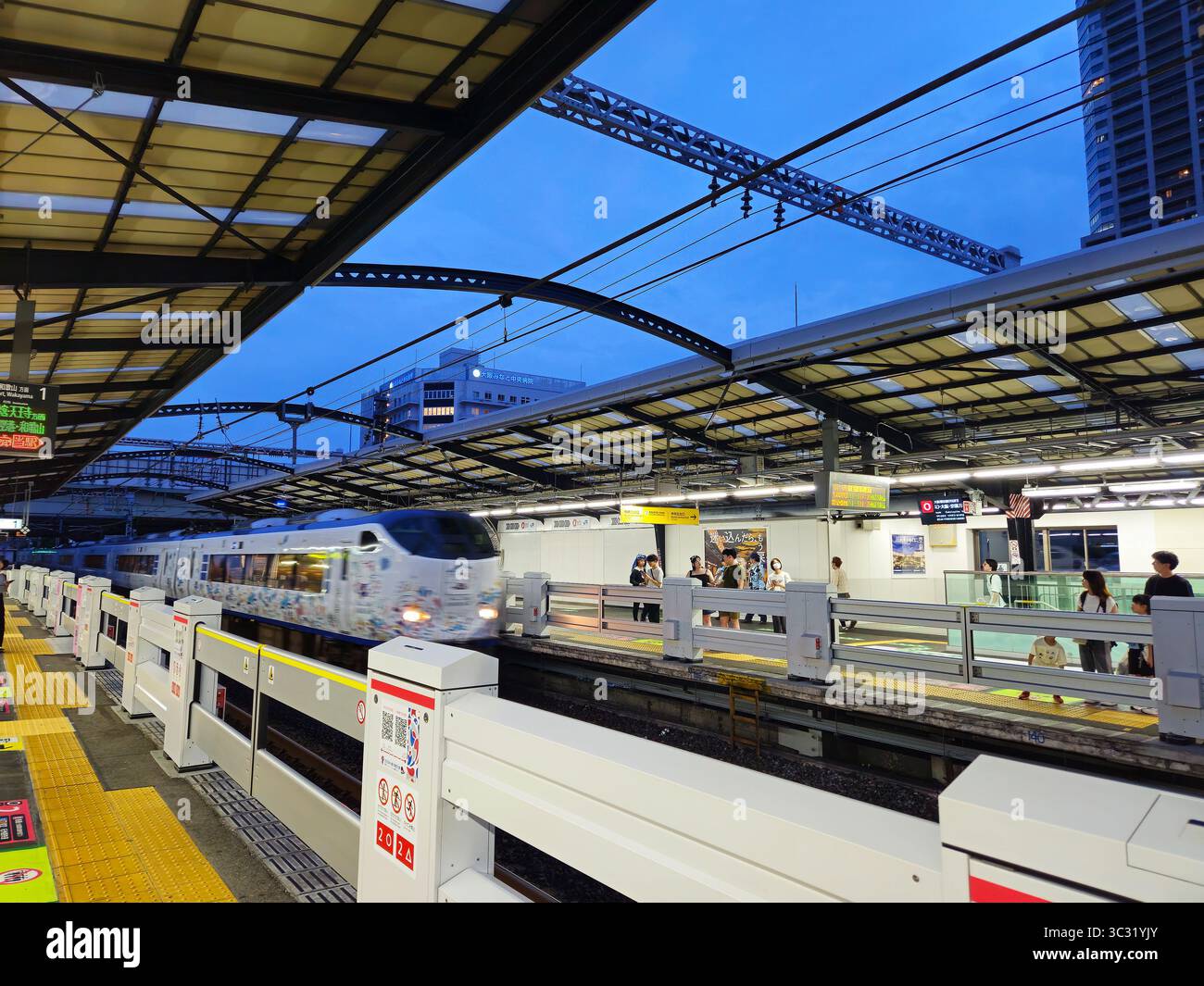 Evening Express Train at Osaka Umeda Station Platform, Japan Stock ...