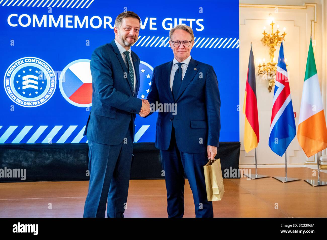 From left Czech Minister of the Interior Vit Rakusan (STAN) shakes ...