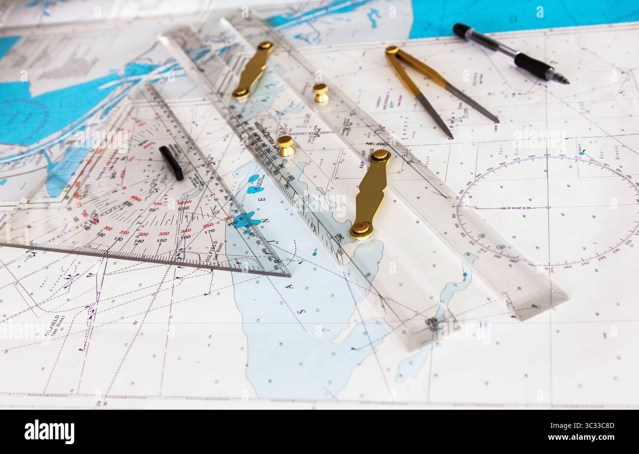 Maps of the ship for plotting. Plotter, divider, ruler and pen. Close ...