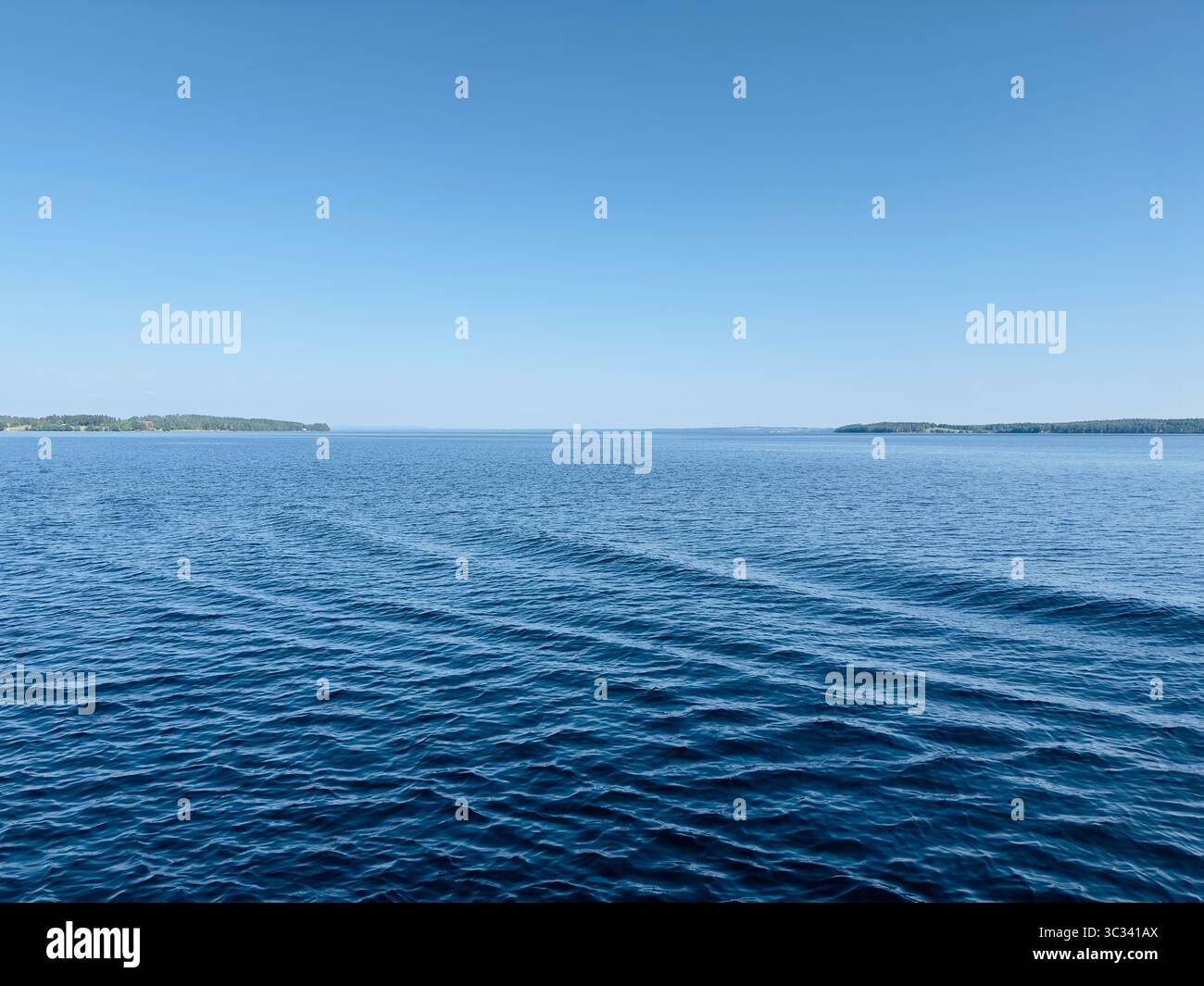 Blue seascape clear sky calm hi-res stock photography and images - Alamy