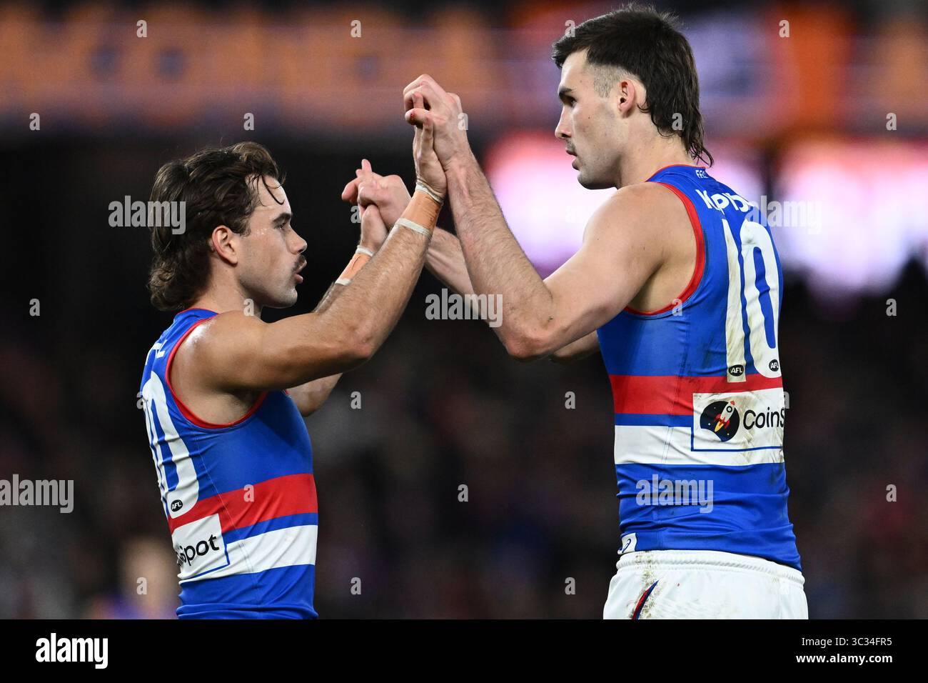 Sam Darcy of Western Bulldogs (right) celebrates scoring a goal during ...