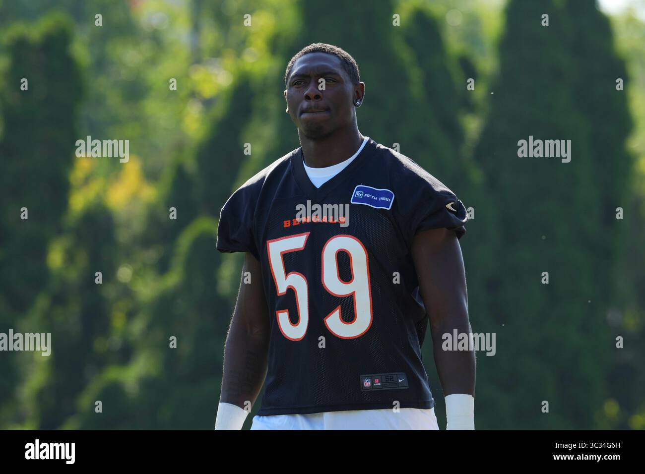 Cincinnati Bengals linebacker Craig Young (59) looks on during practice ...