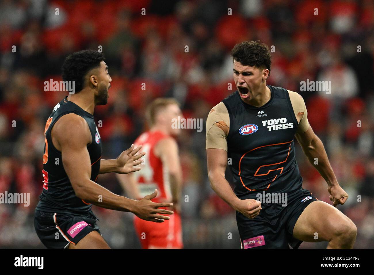 Finn Callaghan of the Giants celebrates after kicking a goal during the ...