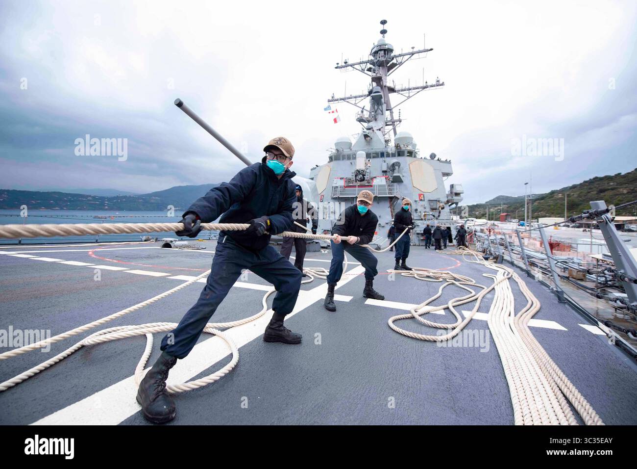 March 24, 2021 - Alabama, USA - Sailors heave in line as the Arleigh ...