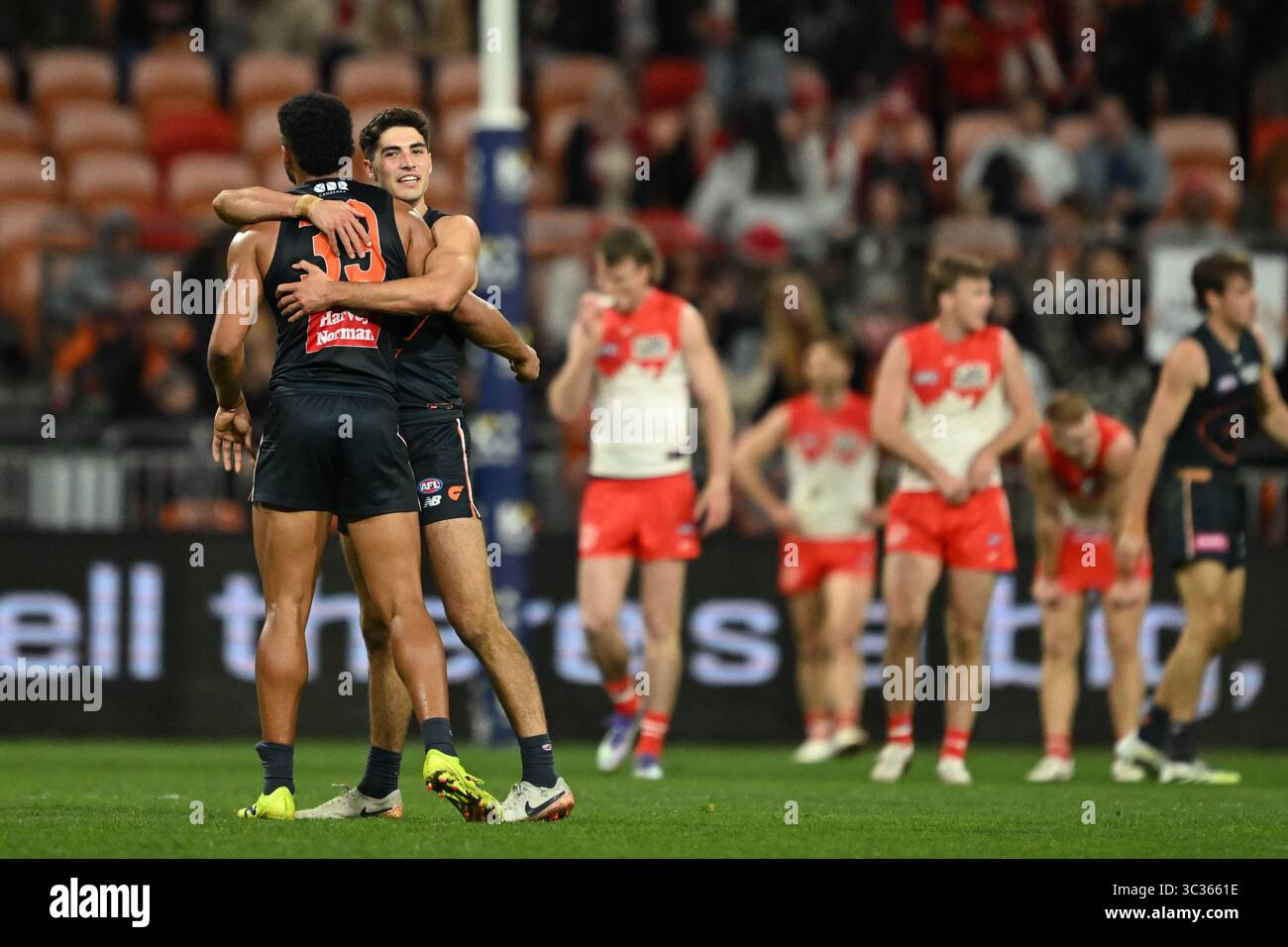 The Giants celebrate their win over the swans during the AFL Round 20 ...