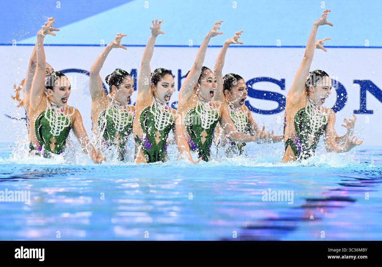 Japanese artistic swimmers perform in the team acrobatic routine final ...