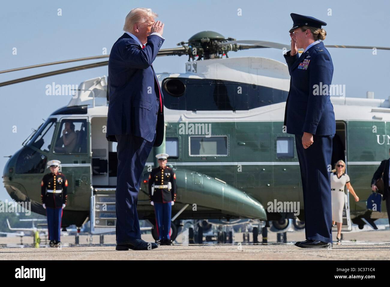President Donald Trump, escorted by Air Force 89th Air Wing Deputy ...