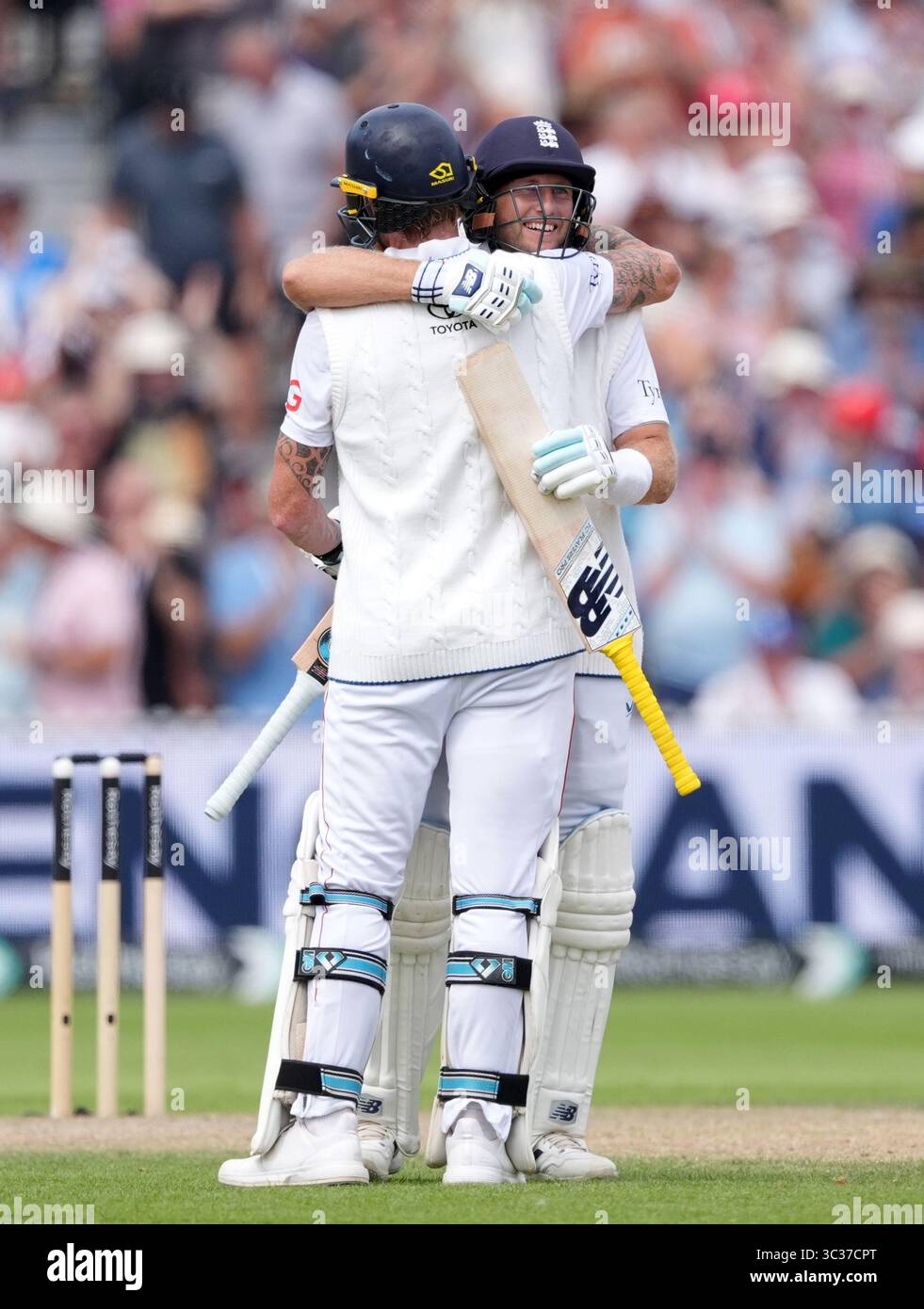 England's Joe Root (right) celebrates with Ben Stokes after reaching ...