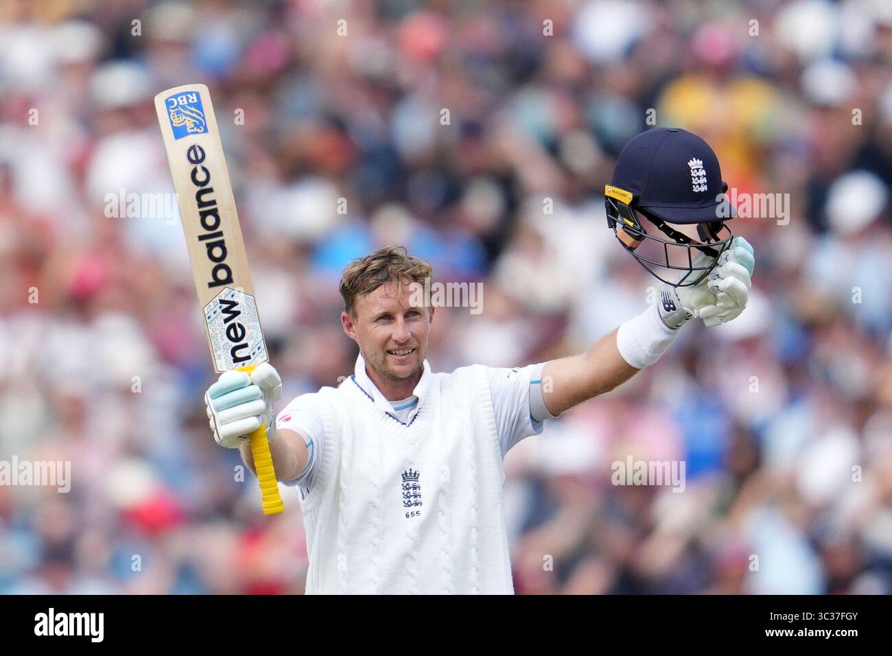 England's Joe Root celebrates after scoring a century on the third day ...