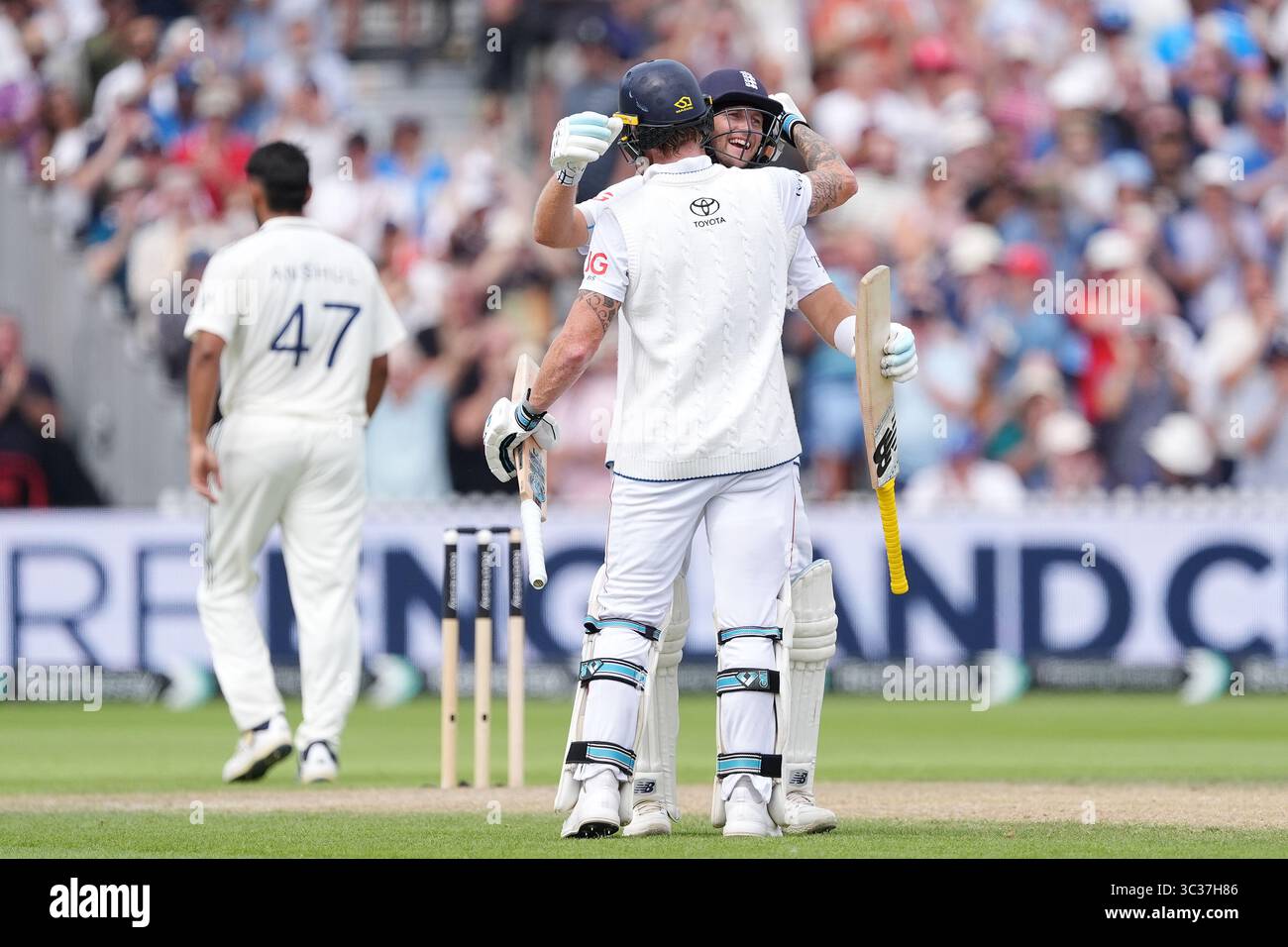 England's Joe Root (right) celebrates with Ben Stokes after reaching ...