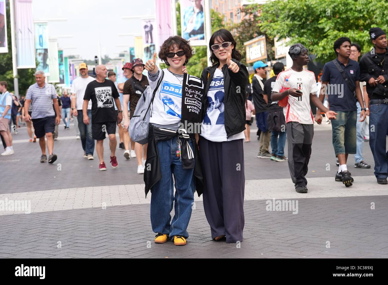Oasis fans pose for a photo on Wembley Way, ahead of the first night of ...