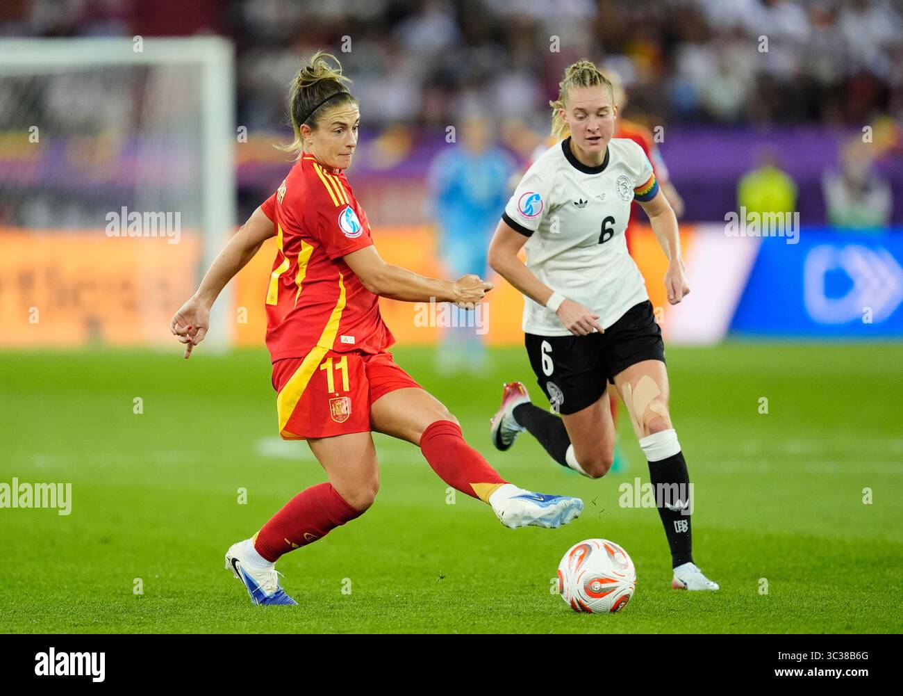 Spain's Alexia Putellas (left) and Germany's Janina Minge in action ...