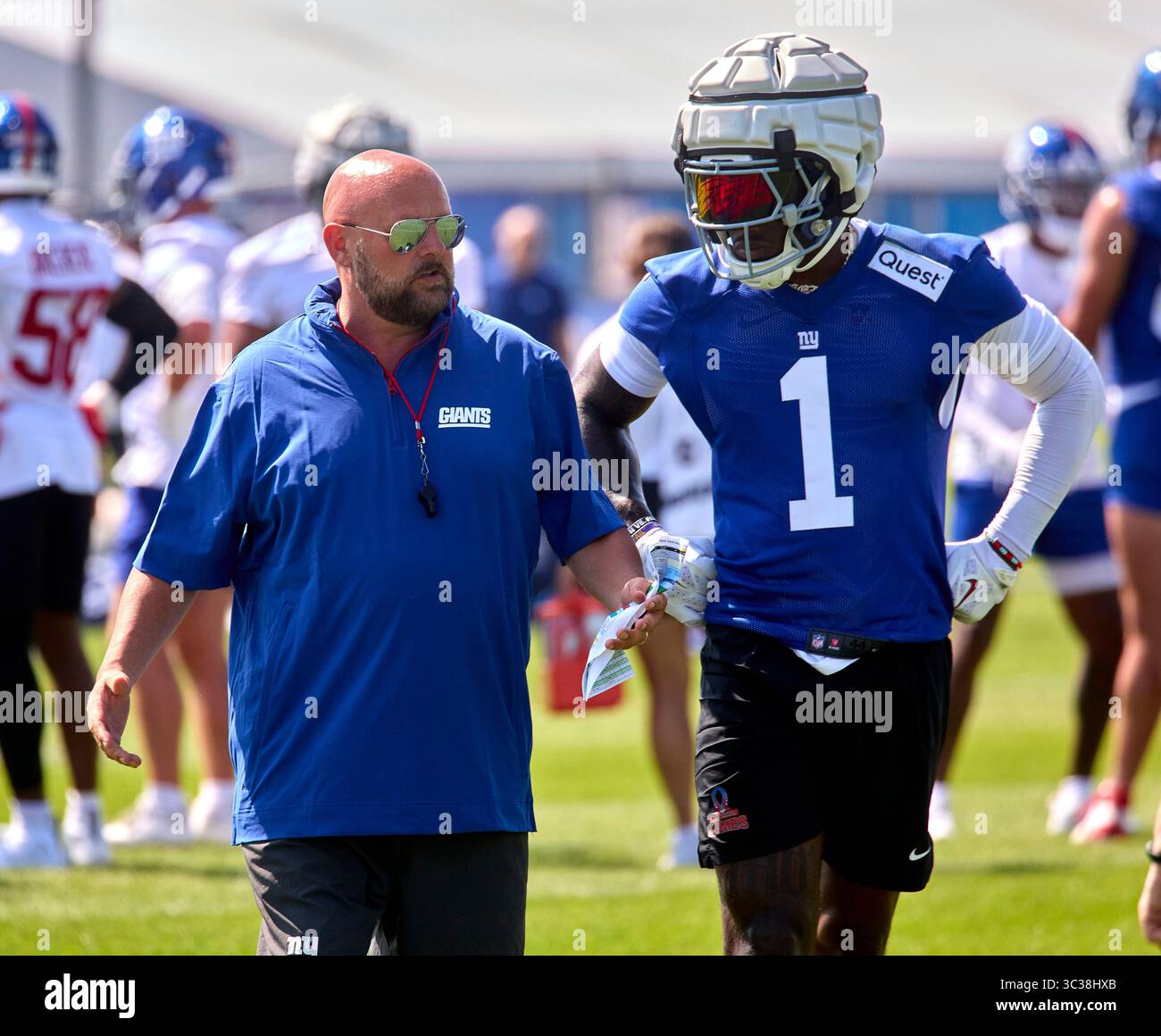 New York Giants head coach Brain Daboll talks with wide receiver Malik ...