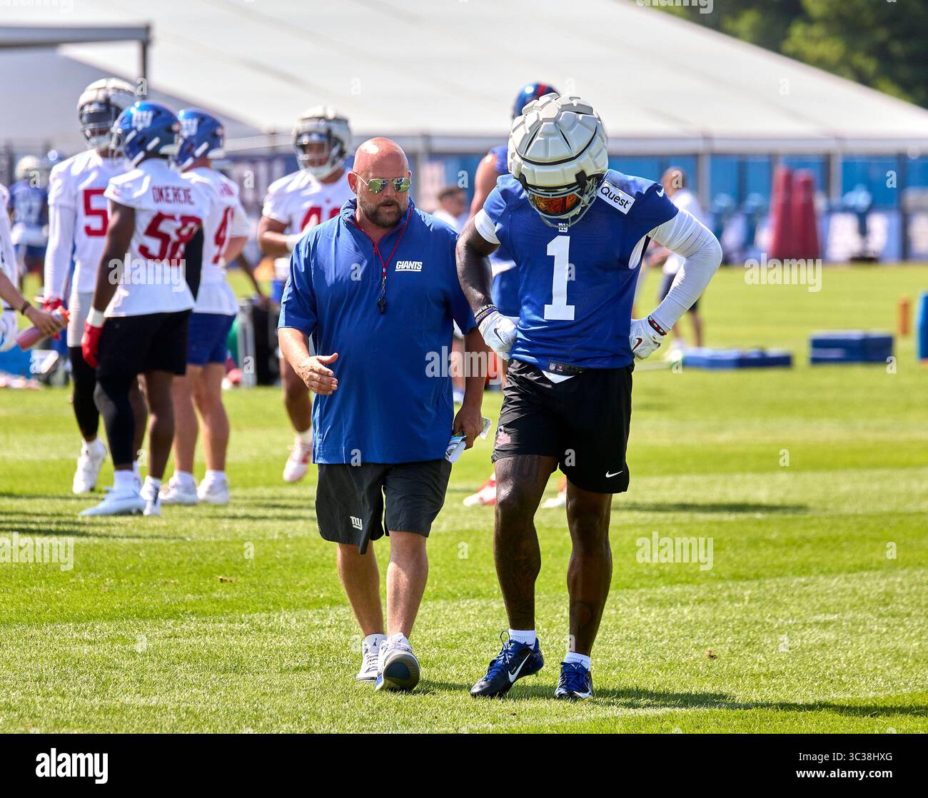 New York Giants head coach Brain Daboll talks with wide receiver Malik ...