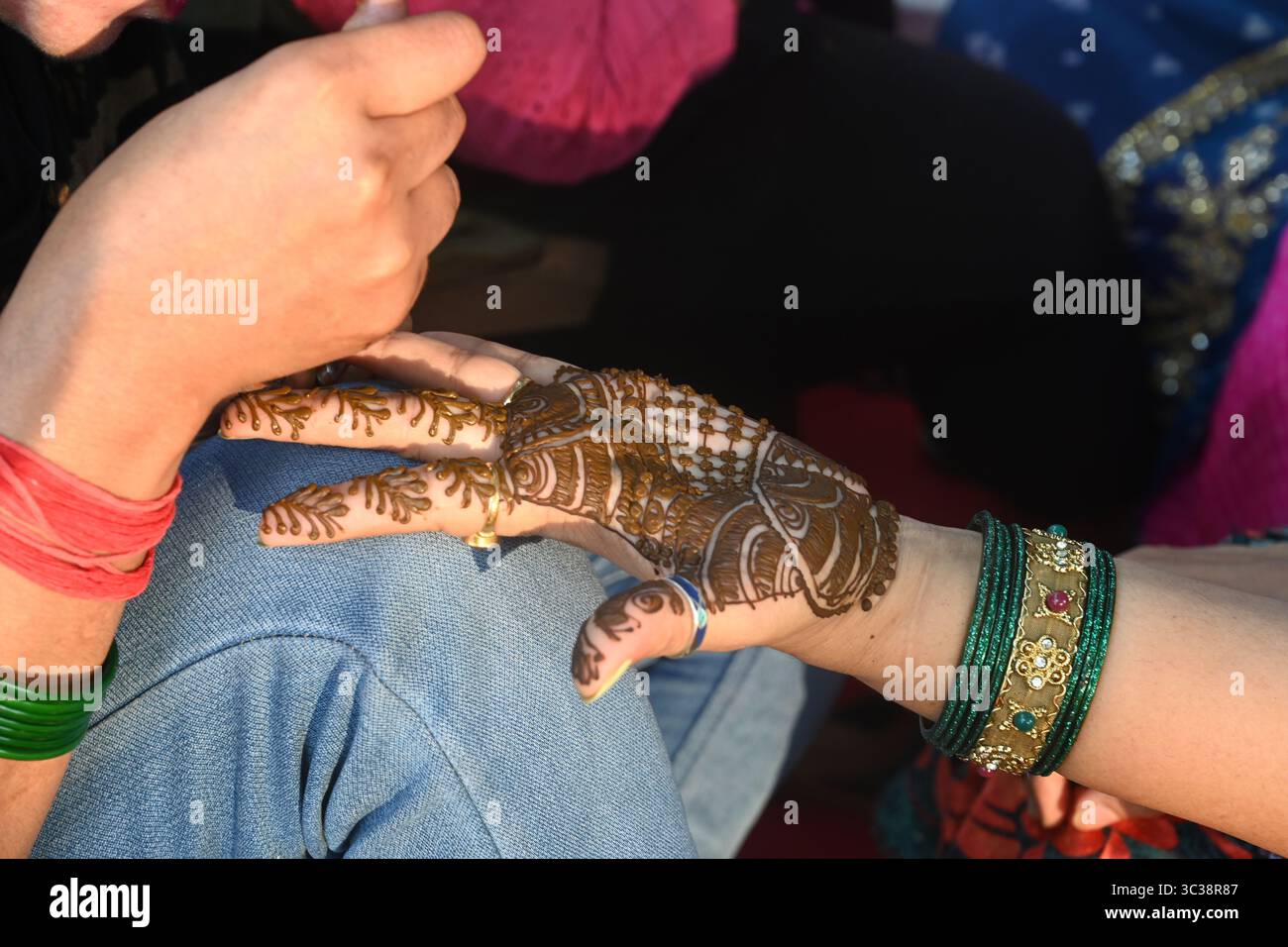 NEW DELHI, INDIA - JULY 24: Women getting mehandi applied to their ...