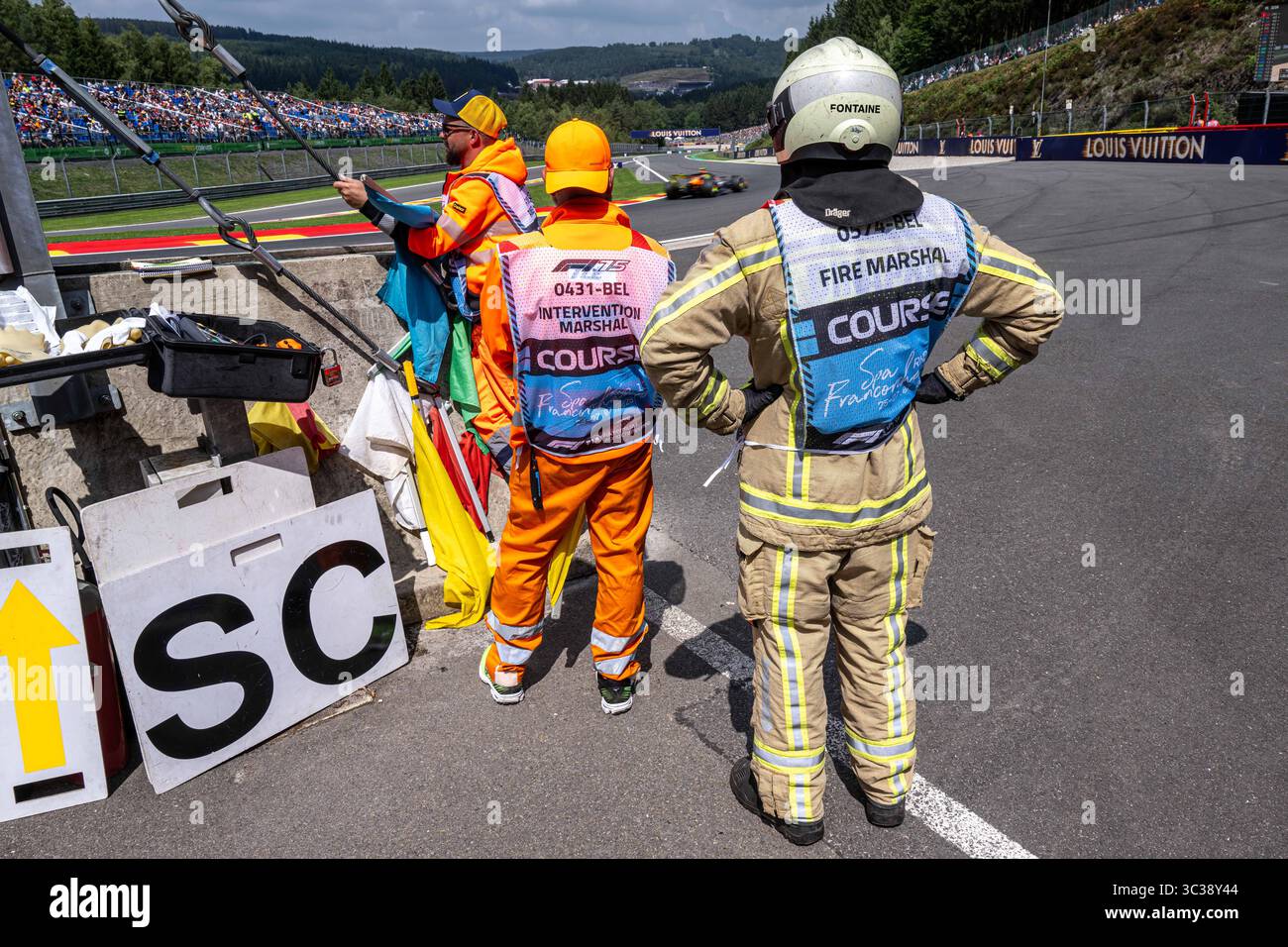 Course marshalls and a fireman are seen during a free practice ahead of ...