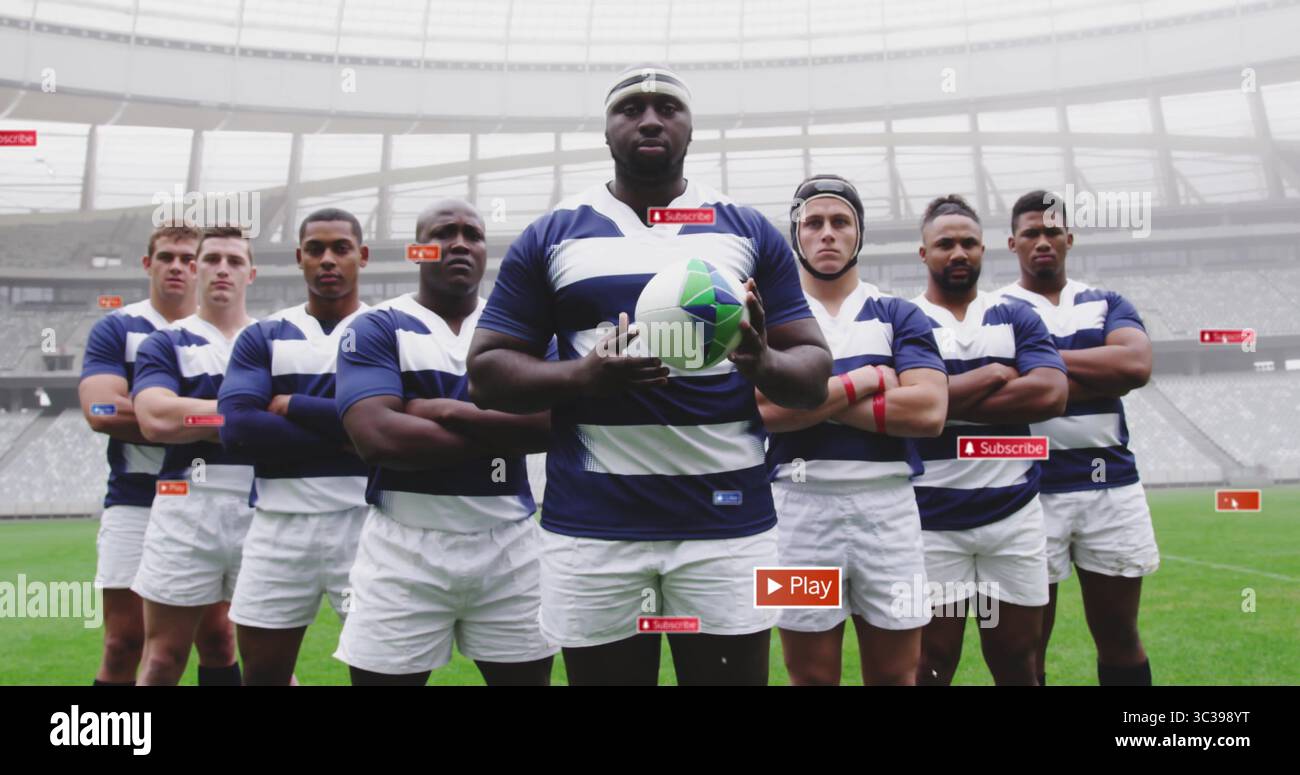 Standing rugby team wearing striped jerseys on stadium pitch, holding ...
