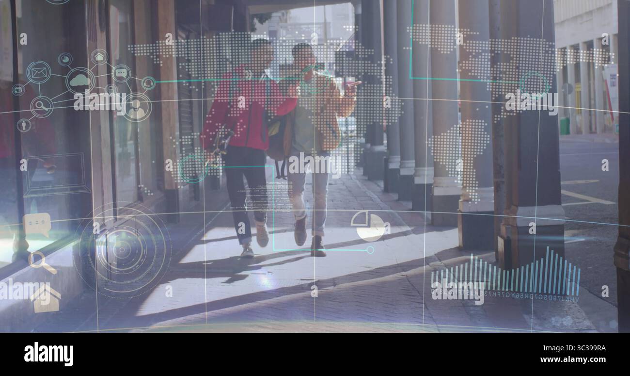 Walking two men wearing red and green jackets along columned walkway ...