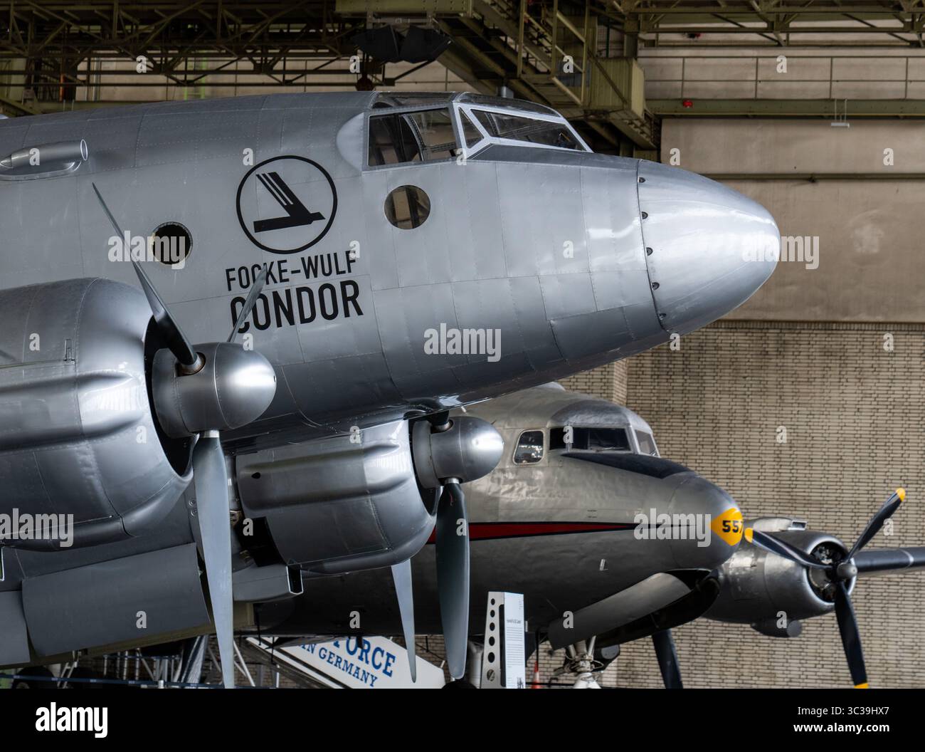 25 July 2025, Berlin: A Focke Wulf 200 "Condor" aircraft (l) and a ...