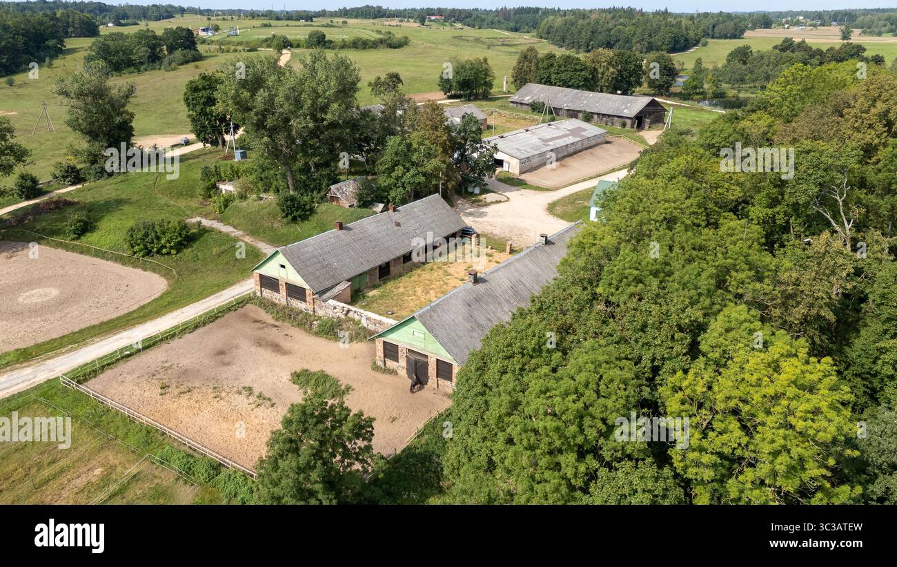Aerial view of a rural farm with barns, stables, and surrounding ...