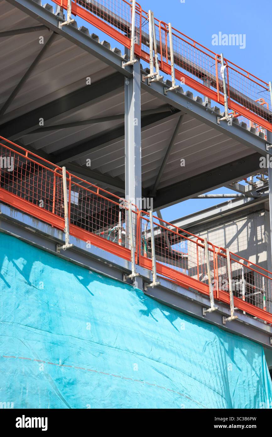 Steel skeleton frame, edge protection safety barrier and green debris netting at radcliffe civic ...