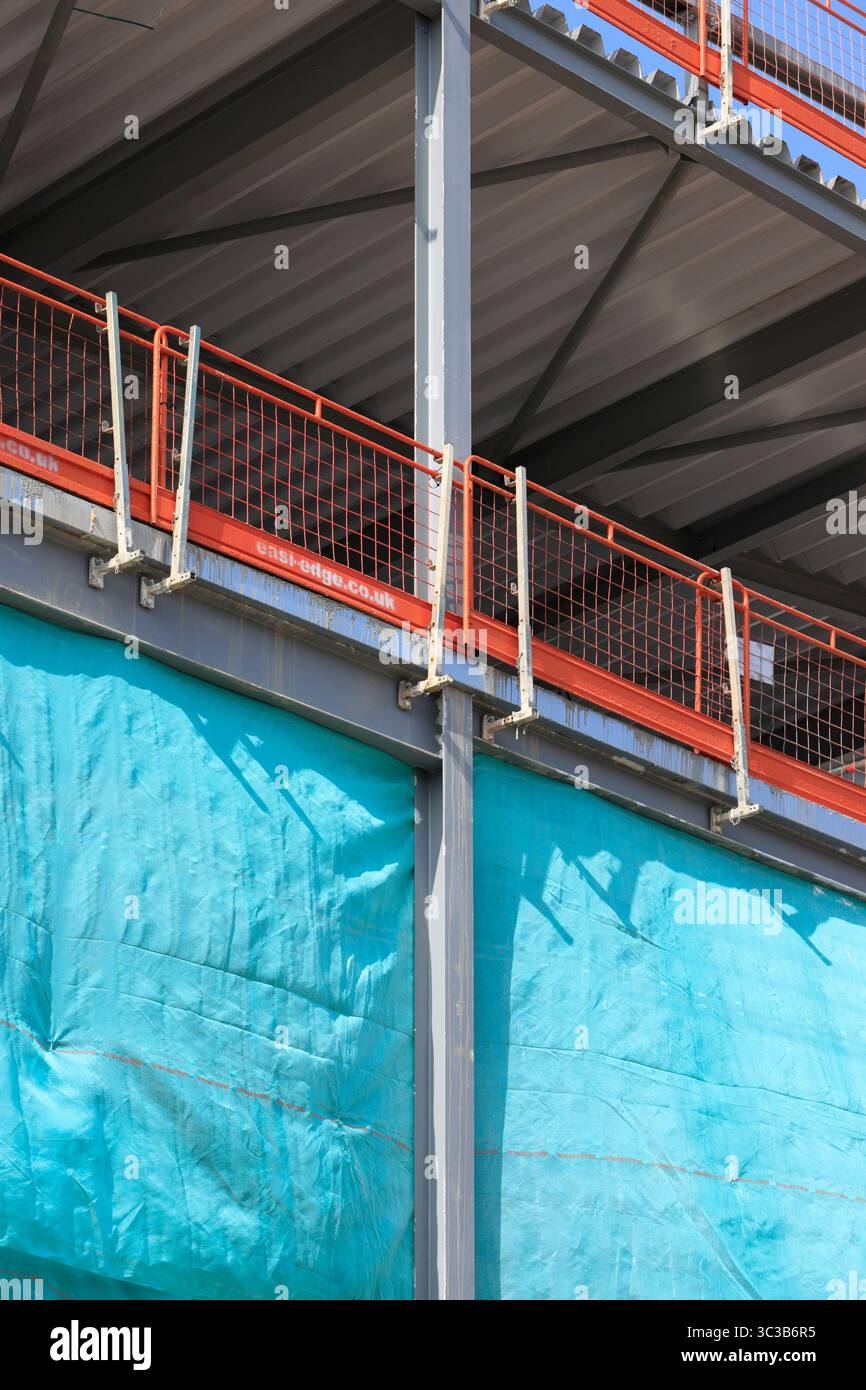 Steel skeleton frame, edge protection safety barrier and green debris ...