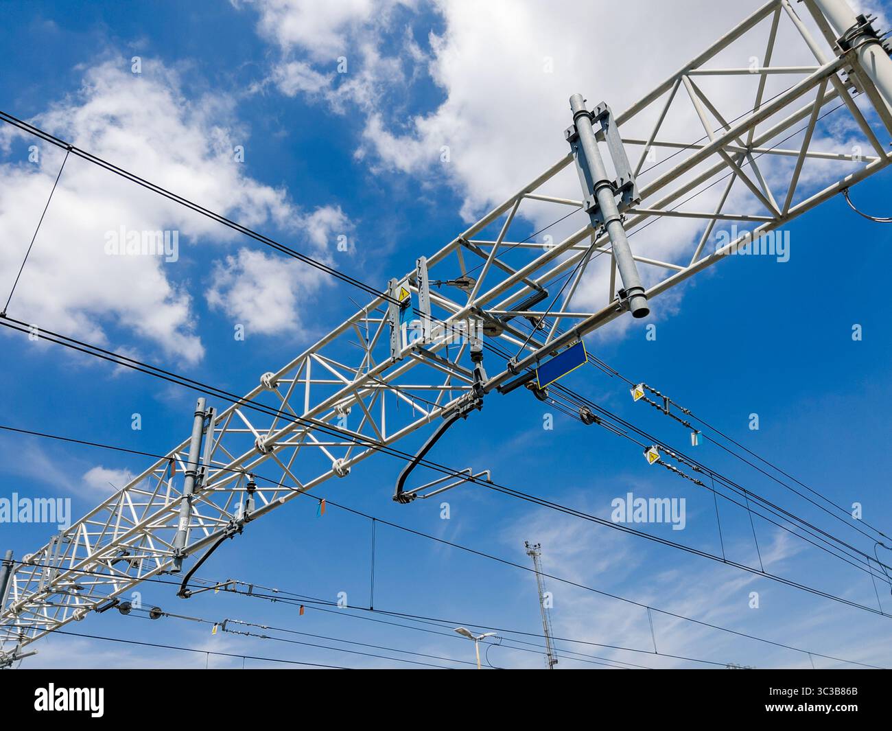 Railway electrification system, Catenary of an electric train on blue ...