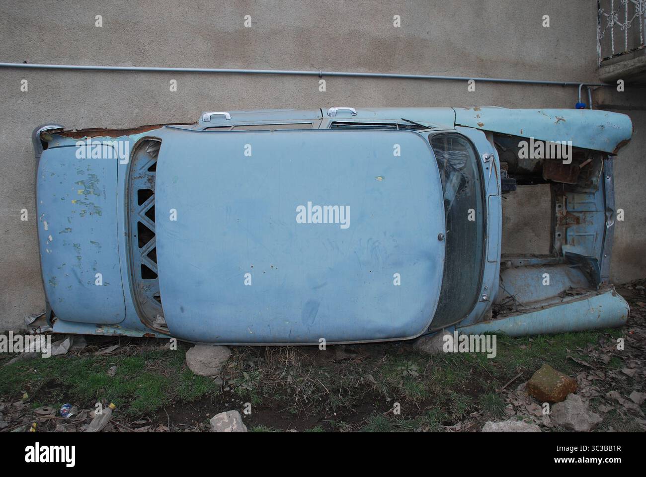 An old soviet Lada car, the bodywork is damaged and rusted, it was left ...