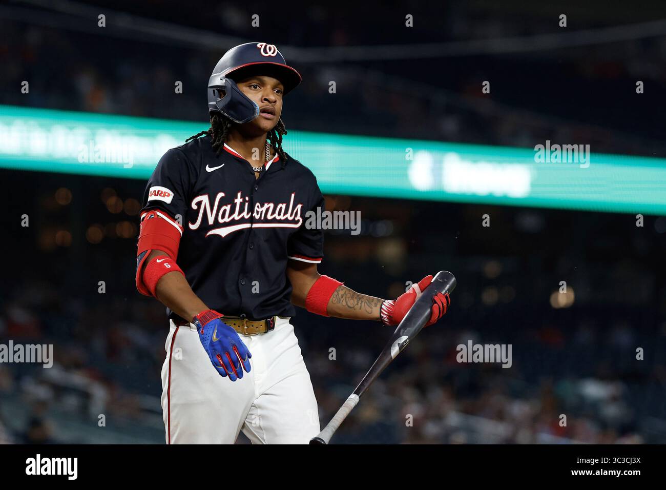 Washington Nationals' CJ Abrams walks off the field after striking out ...