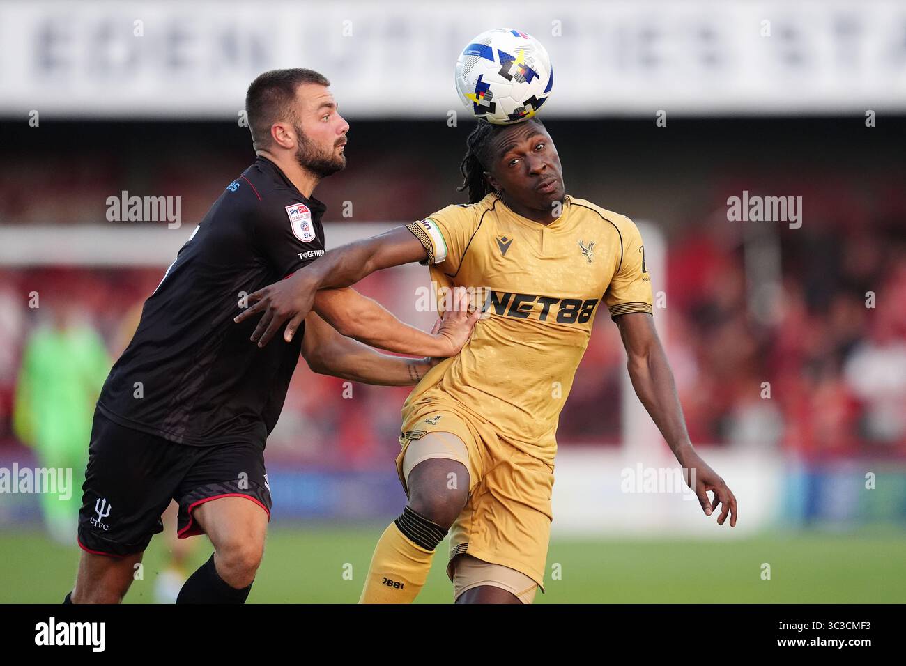 Crystal Palace's Eberechi Eze (right) and Crawley Town's Charlie Barker ...