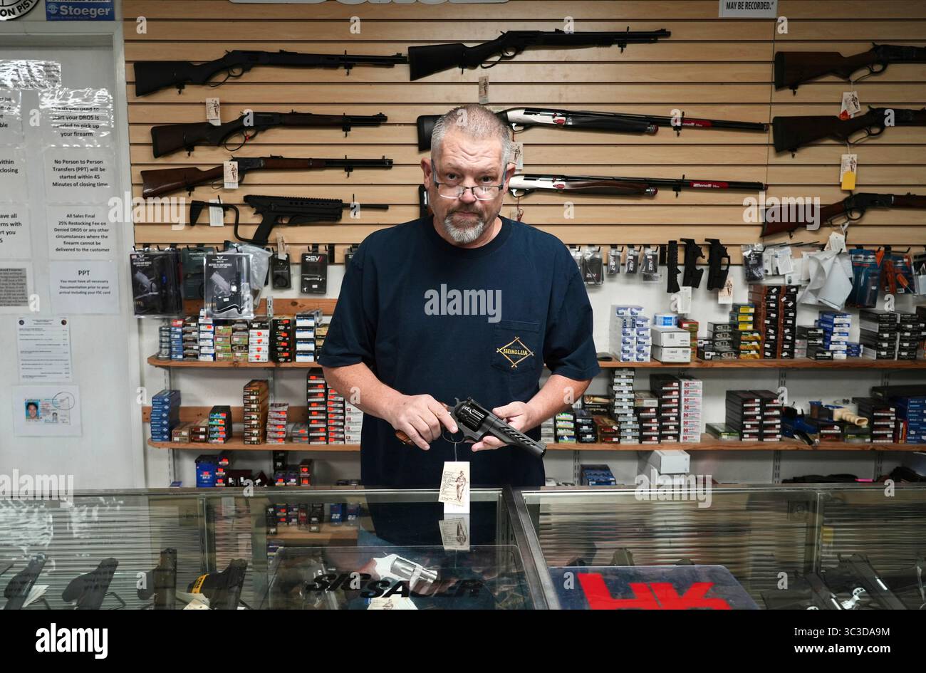 John Parkin, owner of Coyote Point Armory in Burlingame, Calif. poses ...