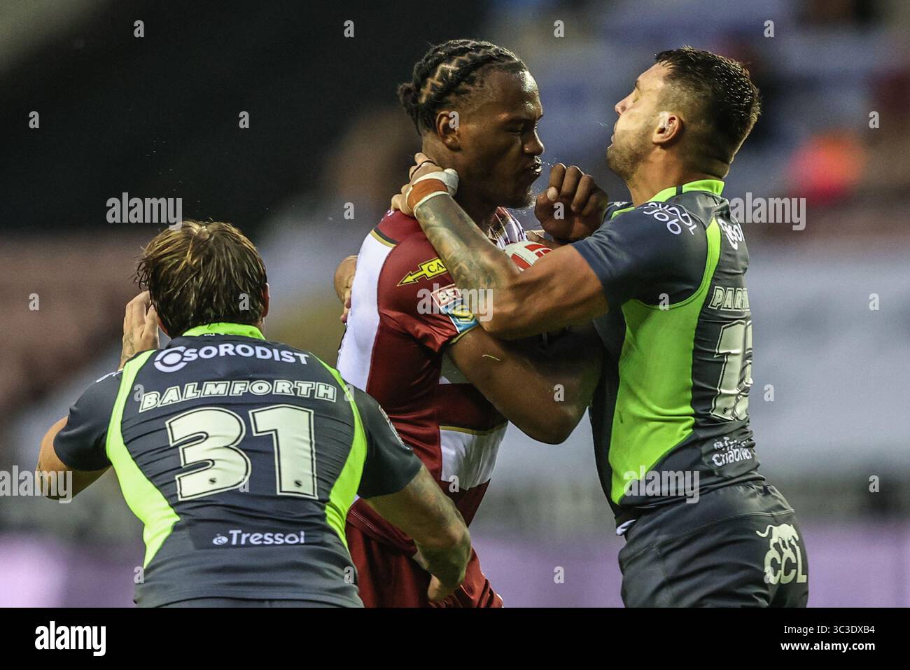 Junior Nsemba of Wigan Warriors is tackled during the Betfred Super ...