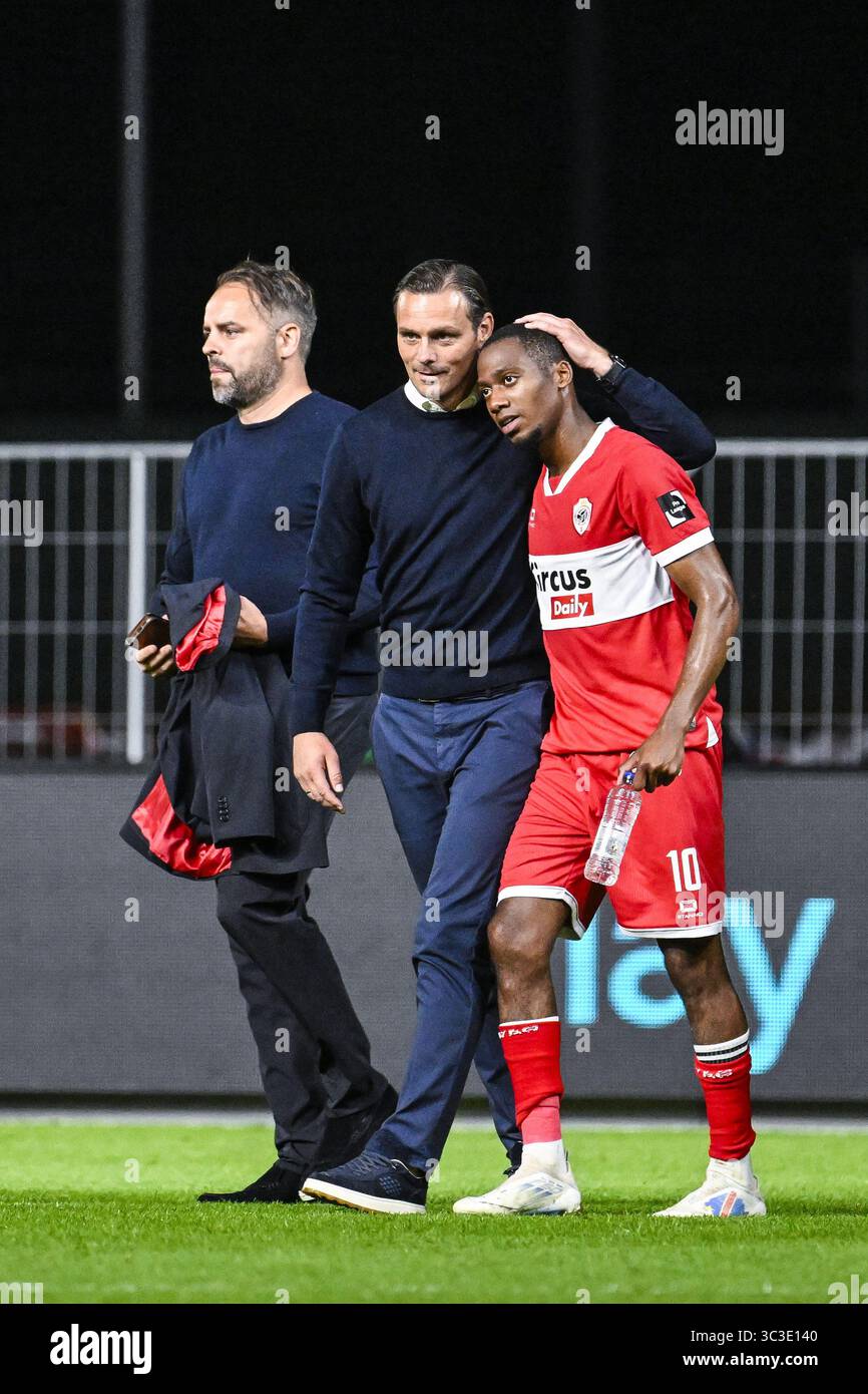 Antwerp's head coach Stef Wils and Antwerp's Michel Ange Balikwisha ...
