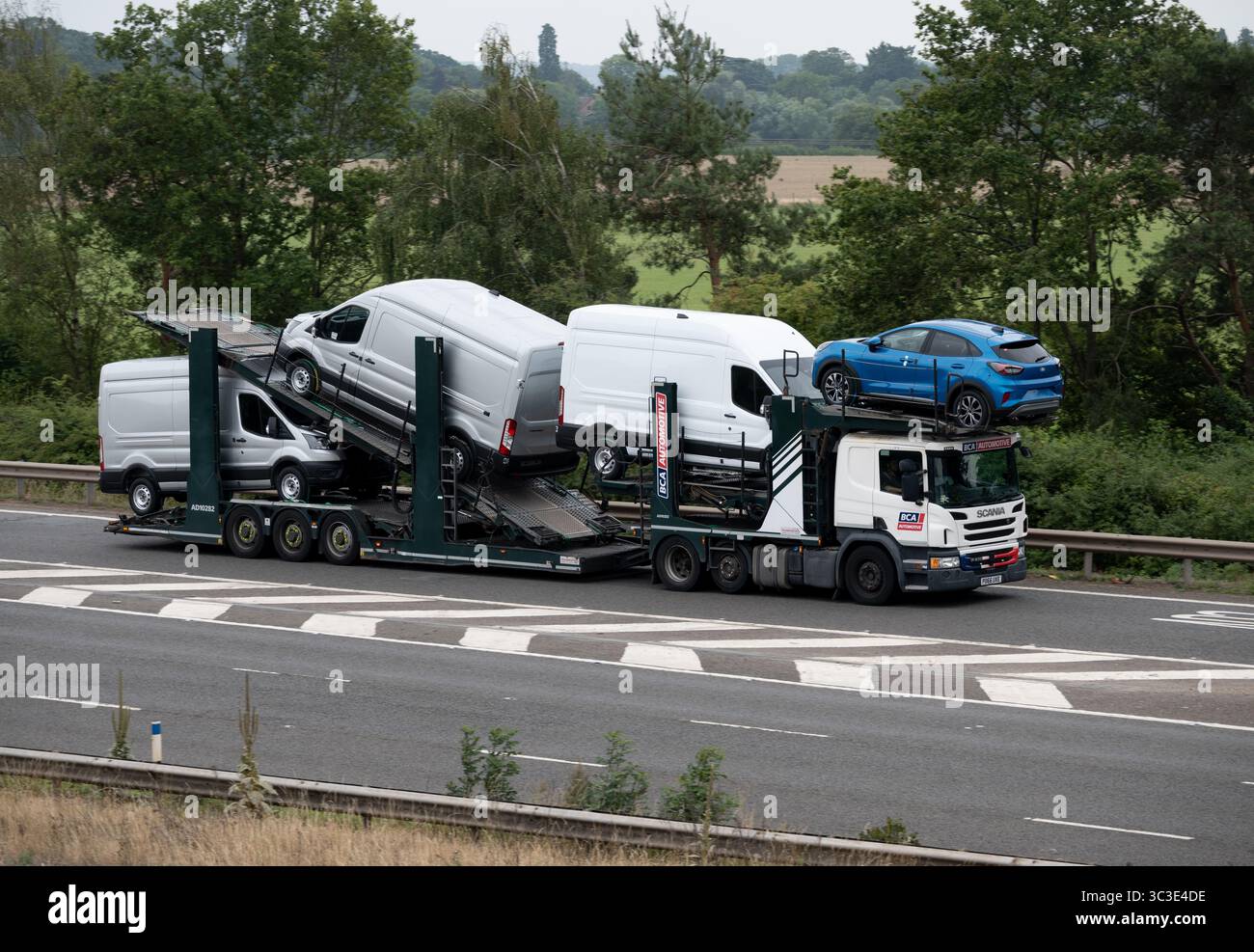 BCA Automotive transporter carrying new Ford vehicles on the M40 ...