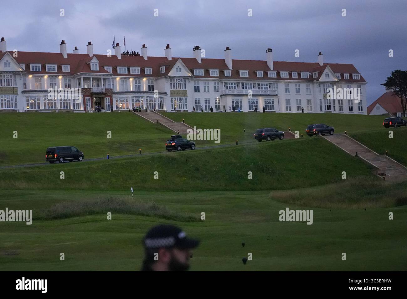 The motorcade with President Donald Trump arrives at the golf course in ...