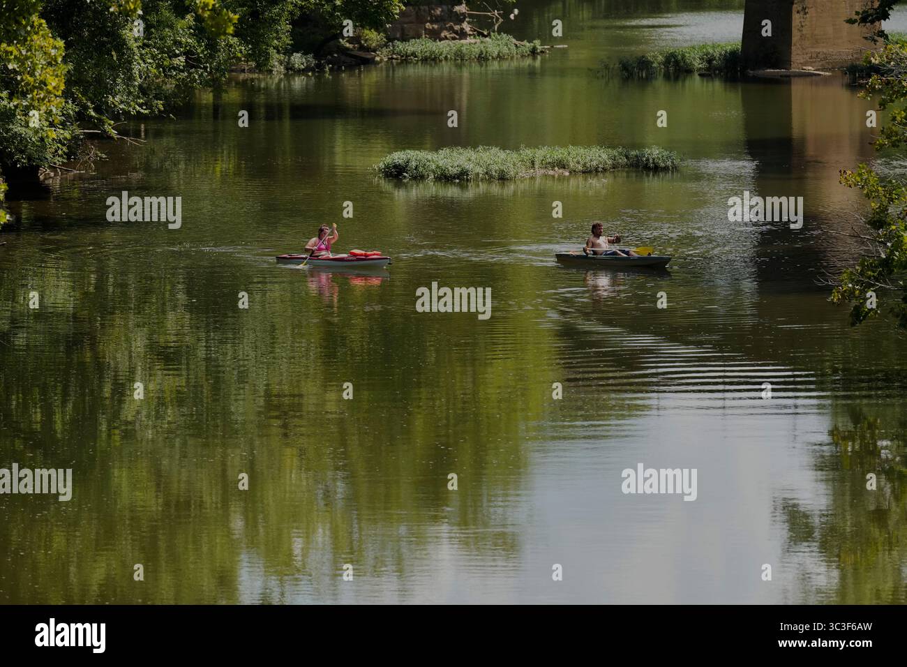 People kayak along the Stones River, Friday during a heat advisory ...