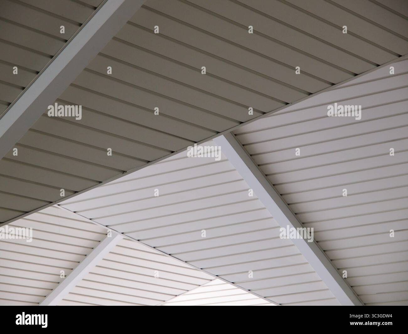 Stacked of white ceilings with pvc plastic panels cladding with strips ...