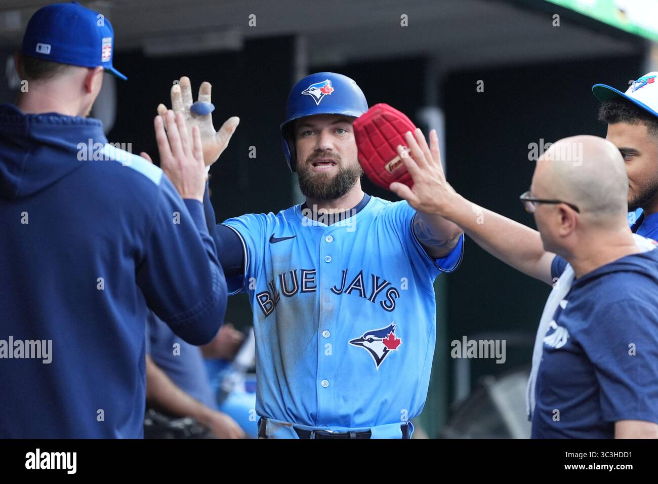Toronto Blue Jays' Nathan Lukes celebrates in the dugout after scoring ...